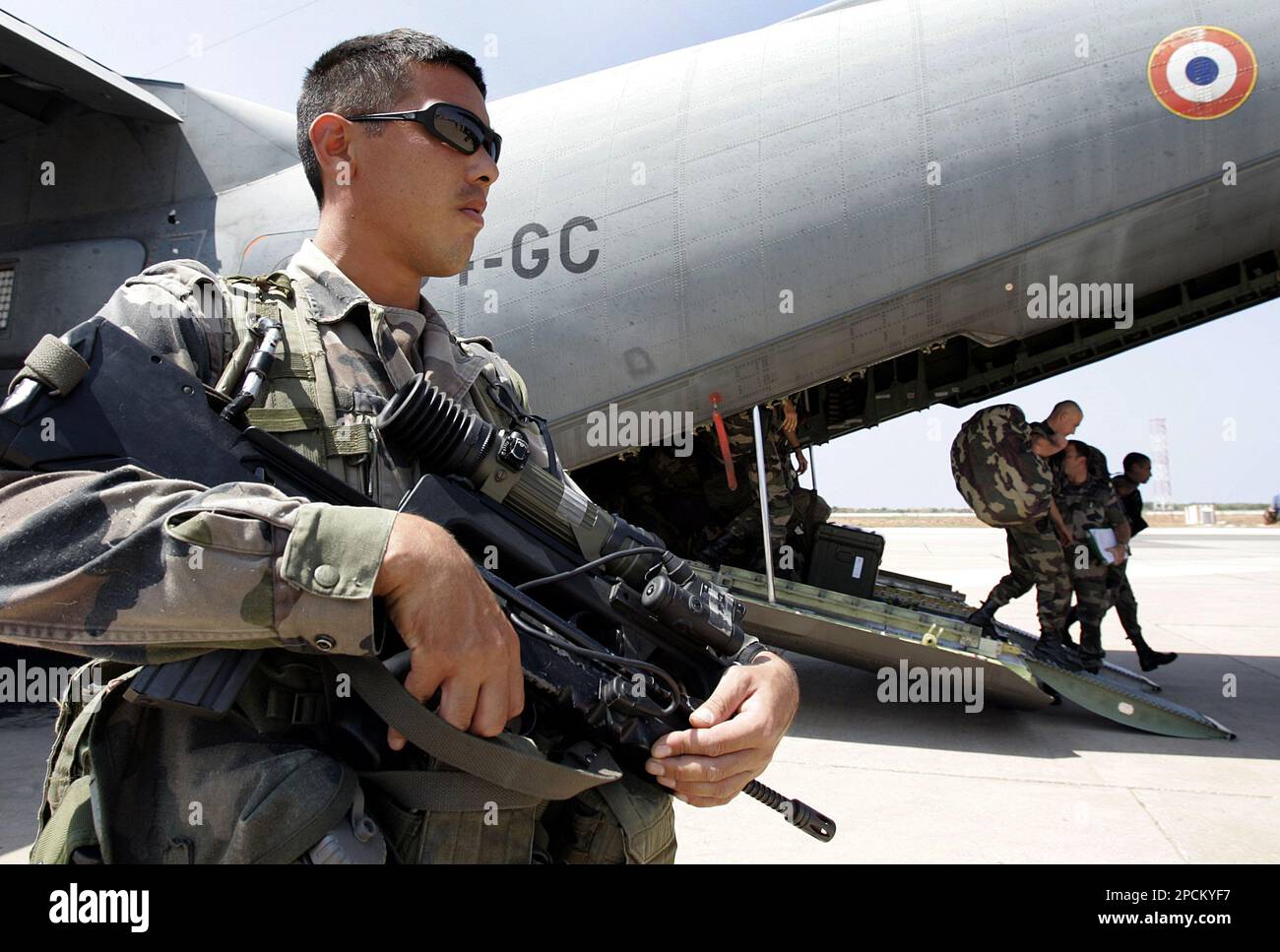 A French soldier stands guard as French soldiers from the Second ...