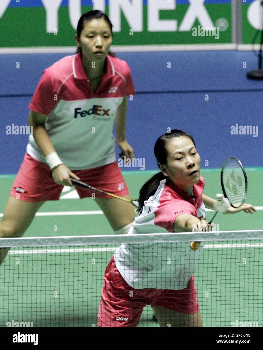 Zhang Jiewen of China, front, returns the shuttlecock against Indonesia's Gresya Polii and Jo ...