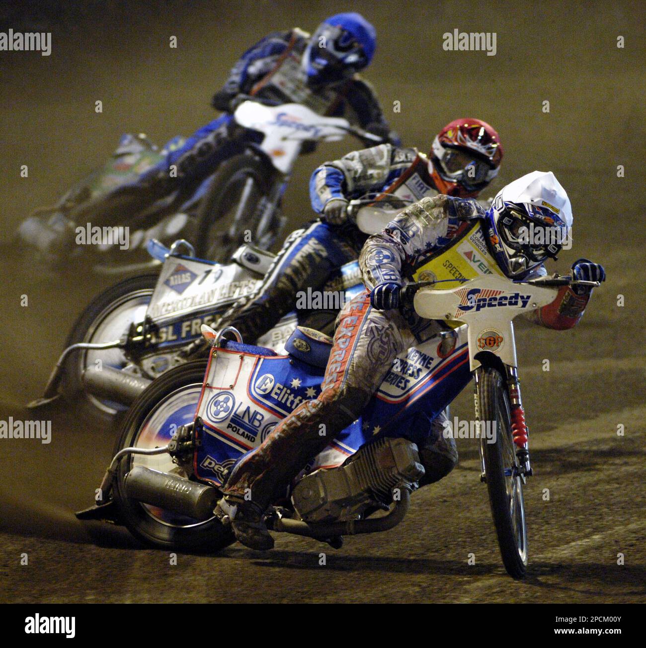 Jason Crump of Australia, front, Hans Andersen of Norway, center, and ...