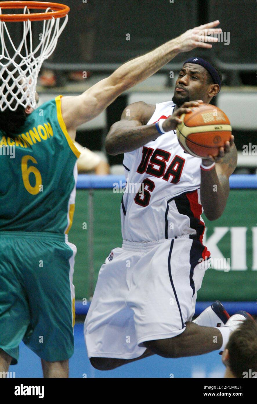 The USA's LeBron James takes a shot over Australia's Sam Mackinnon in a ...