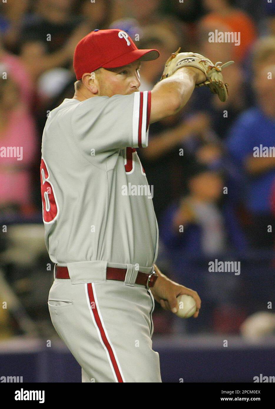Philadelphia Phillies pitcher Aaron Fultz reacts after giving up a two ...