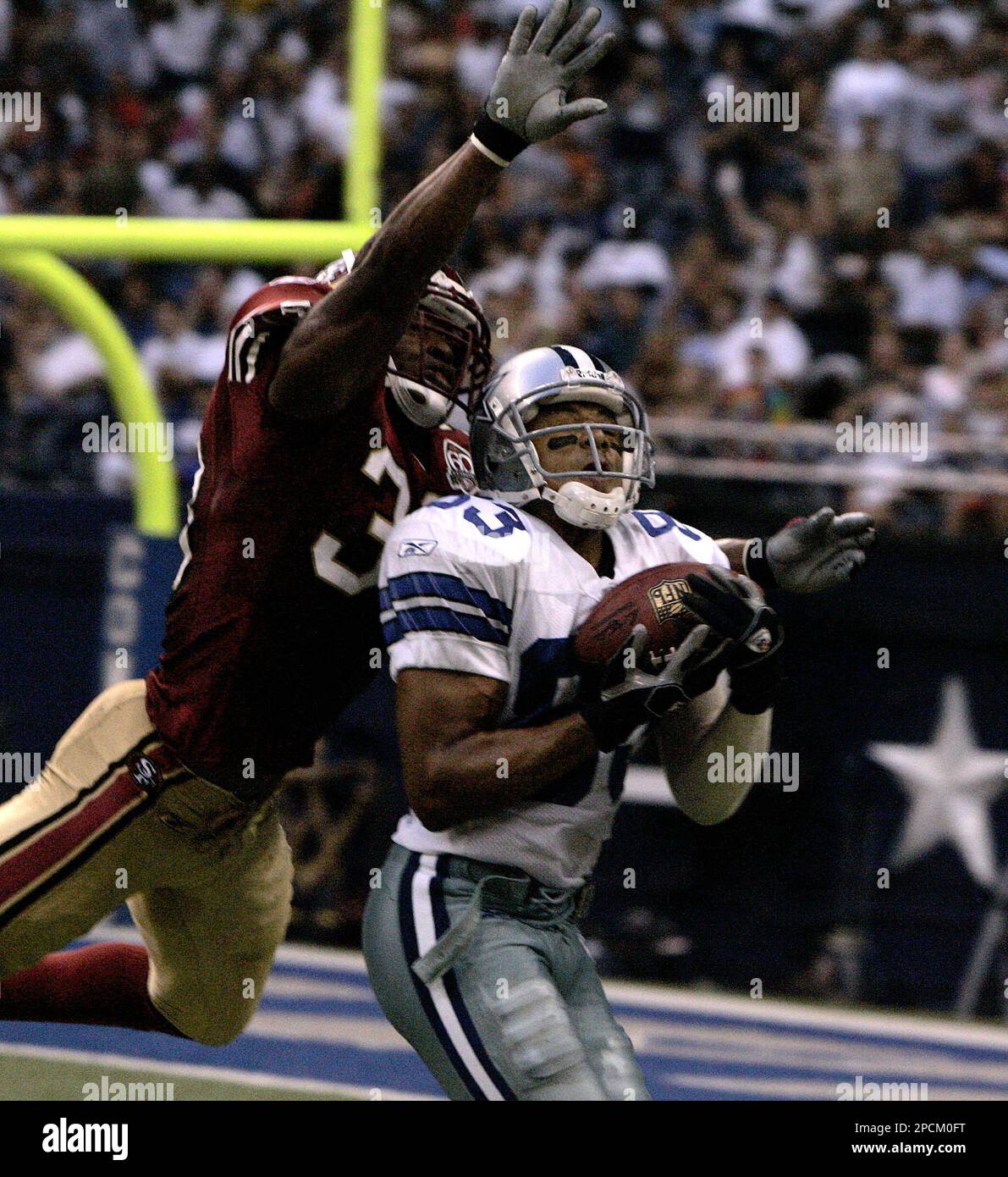 Dallas Cowboys wide receiver Terry Glenn (83) pulls in 52-yard pass ...