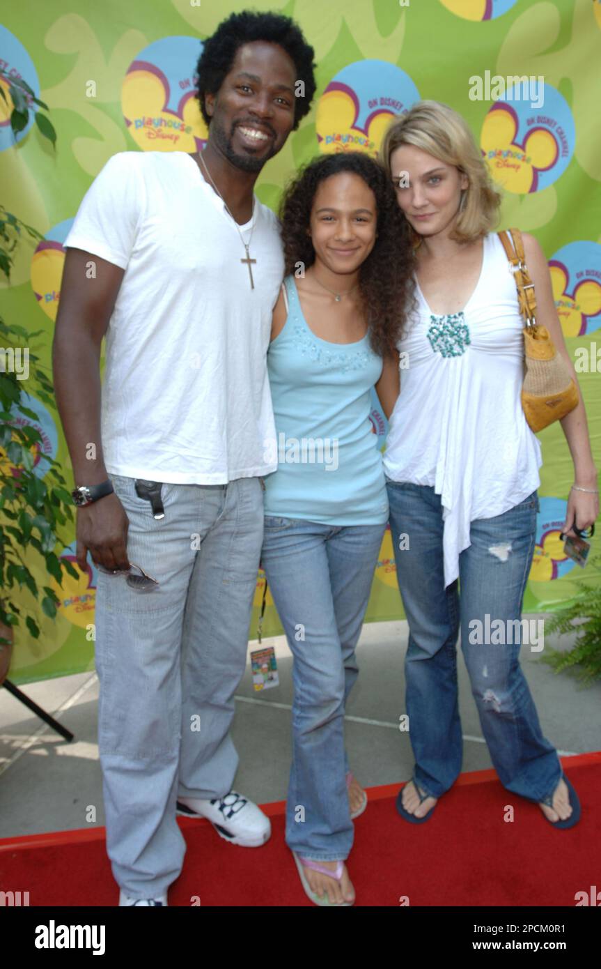 Actor Harold Perrineau, left, his wife Brittany, right, and daughter ...
