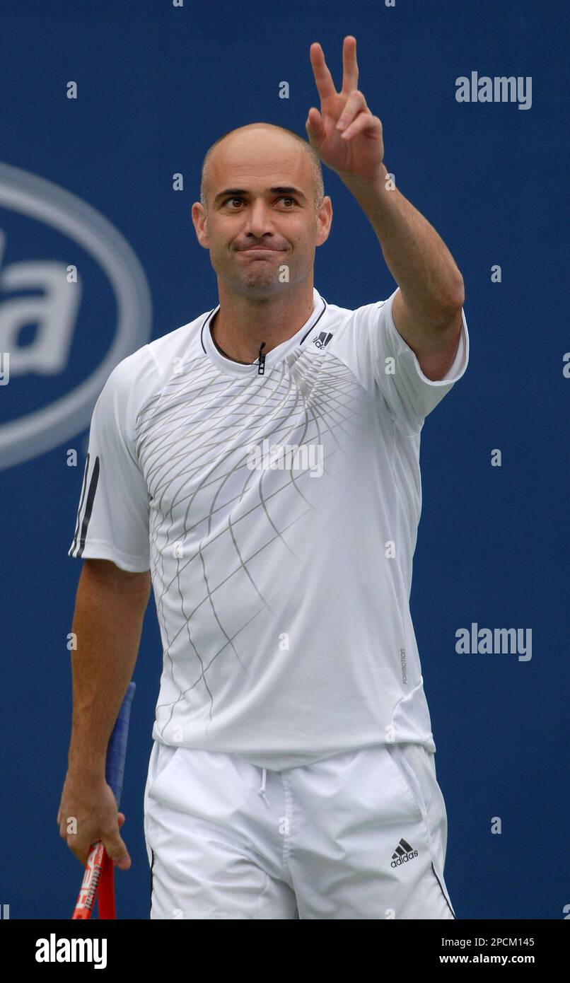 Tennis great Andre Agassi takes part in Arthur Ashe Kids' Day ...