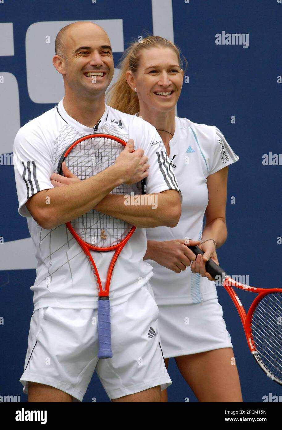 Tennis greats Andre Agassi, left, and his wife Steffi Graf take part in ...