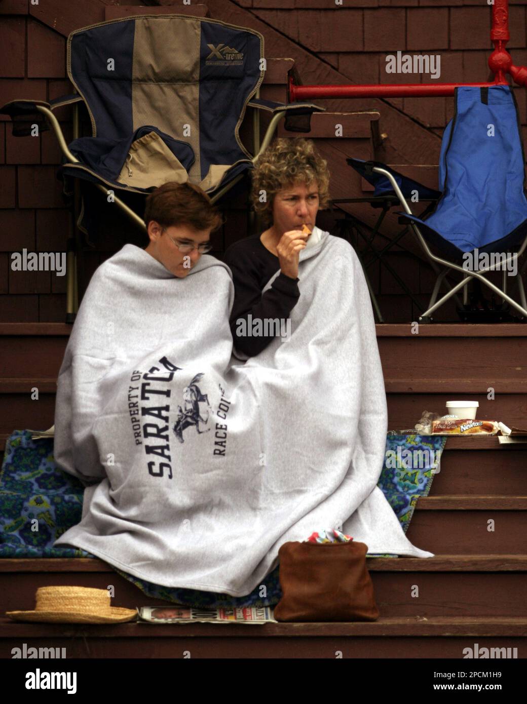Gail Figgins, right, and her son, Ray, from Uppersville, Va., snack on ...