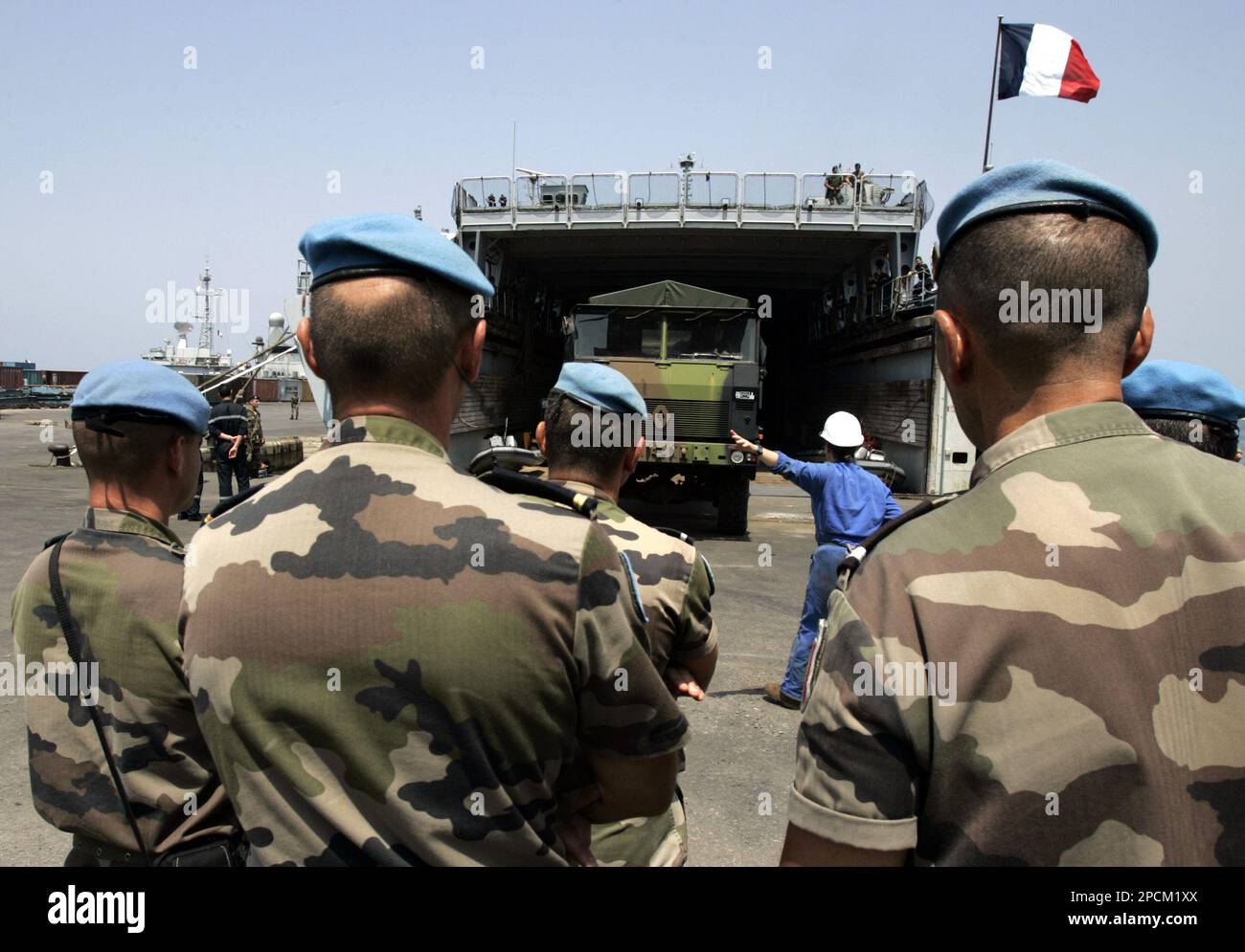 United Nations peacekeepers from France look on as a French marine ...