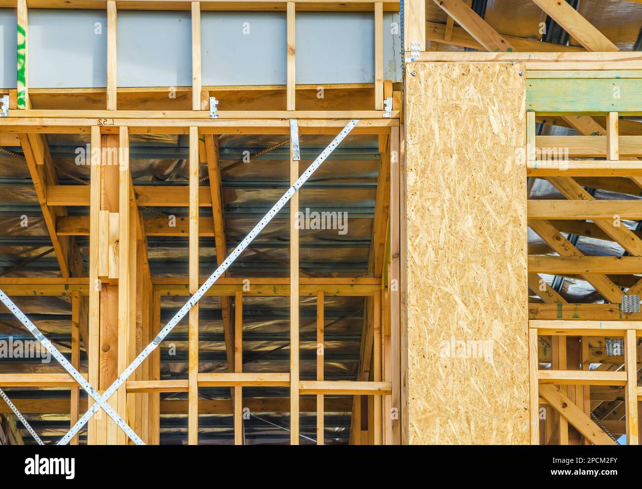 Detail of wooden framework of a building under construction, with ...