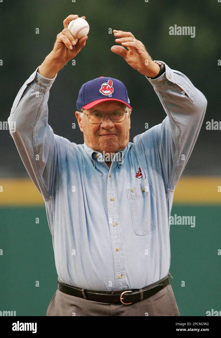 Hall of Fame pitcher Bob Feller winds up for a ceremonial pitch before ...