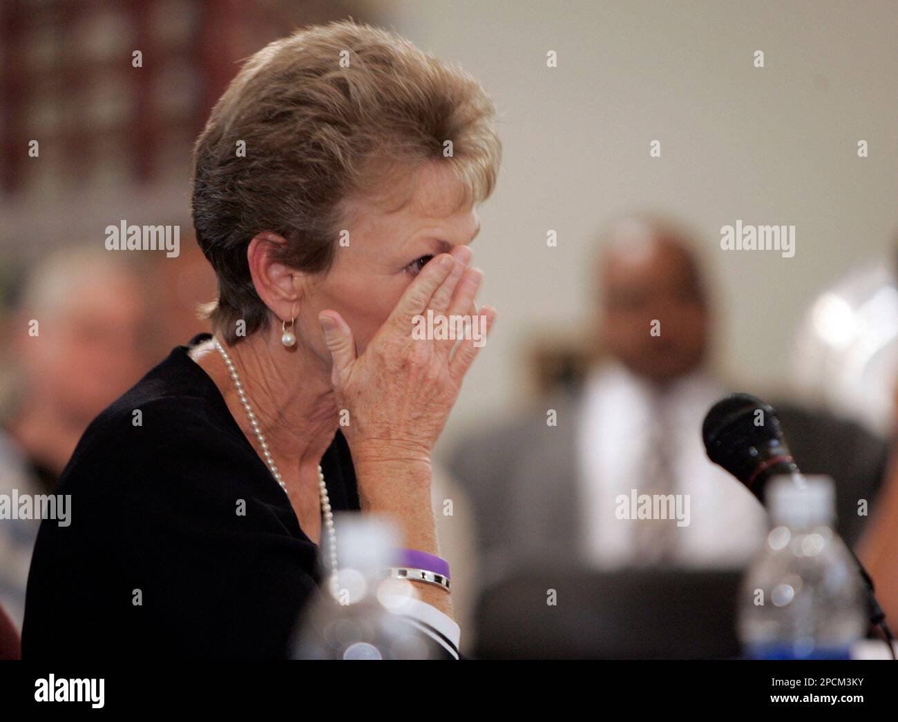 Emily Moose, mother of Scott Gardner, wipes a tear from her eye as she ...