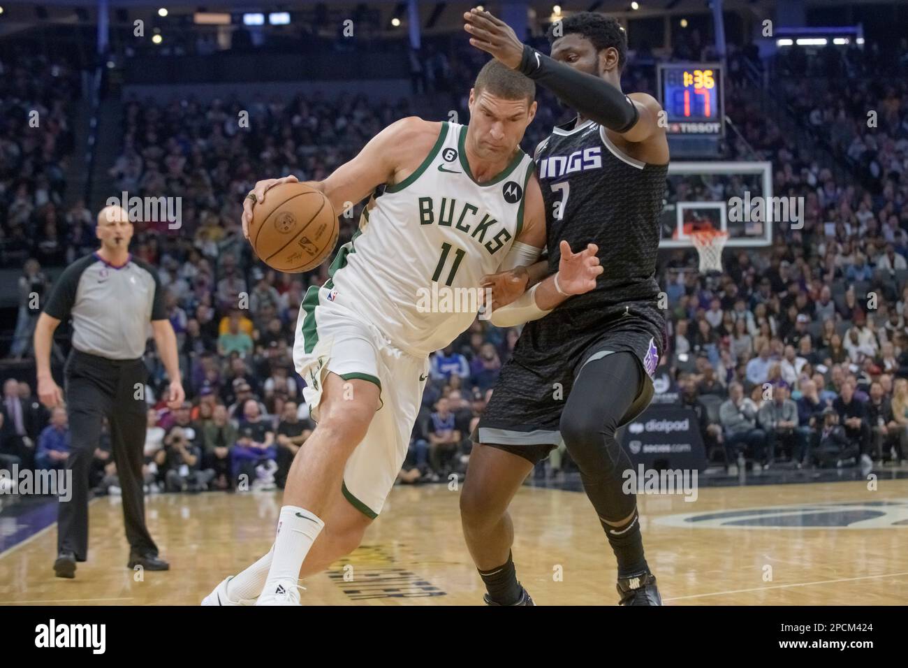 Milwaukee Bucks center Brook Lopez (11) is guarded by Sacramento Kings ...
