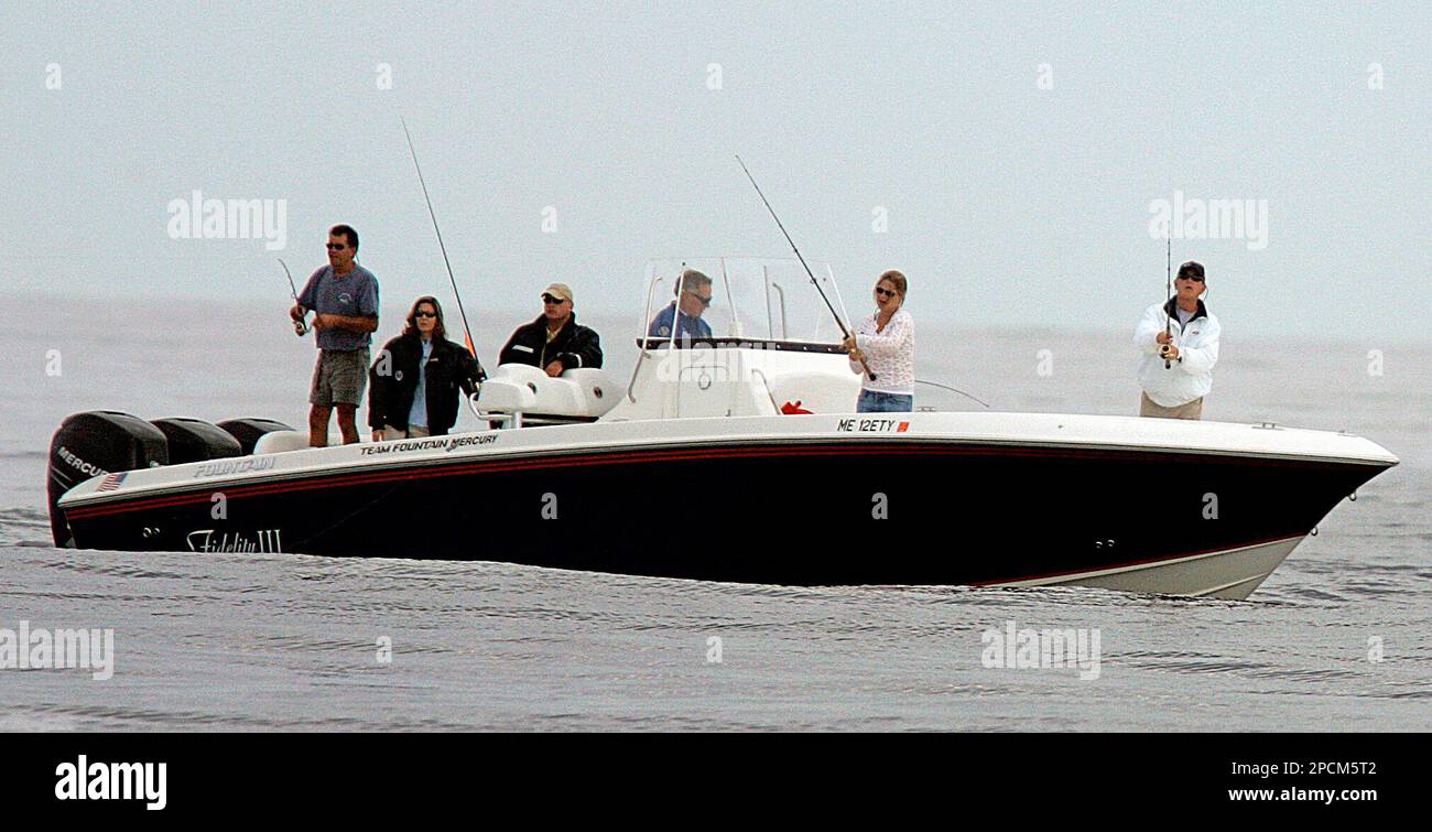 President George W. Bush, right, casts his line as his daughter Jenna ...