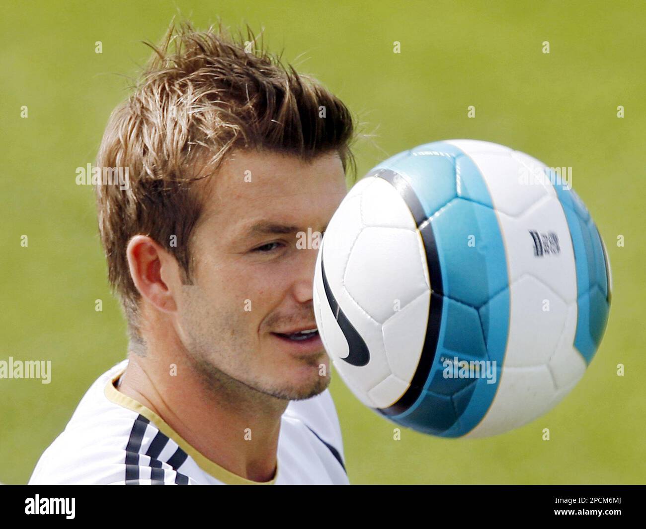 Real Madrid player David Beckham from England eyes a ball during a ...