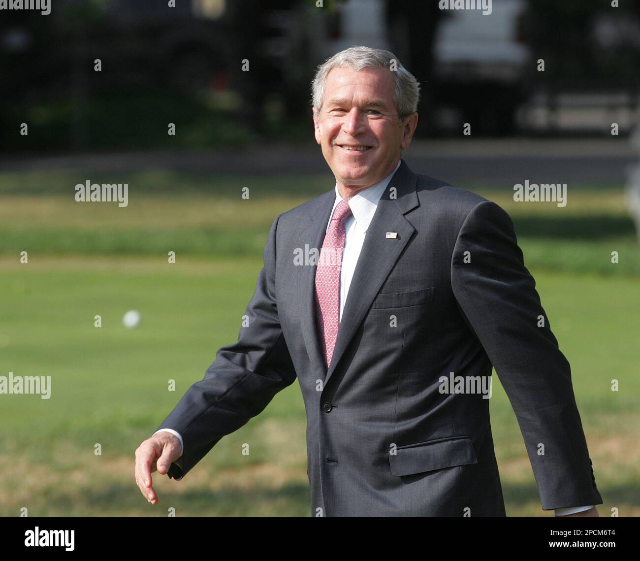 President Bush smiles as he departs the White House, Thursday, Aug. 24 ...