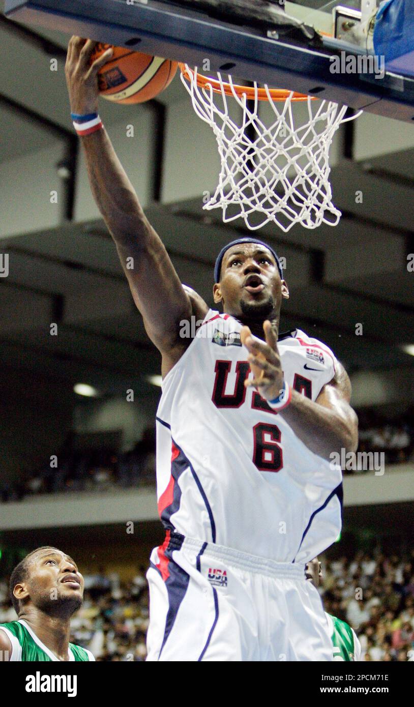 USA's LeBron James goes up for a shot Senegal's Jules Richard Aw looks ...