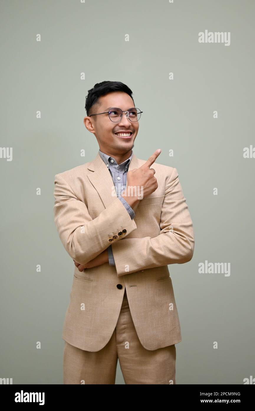 Smiling millennial Asian businessman or male boss in formal business ...