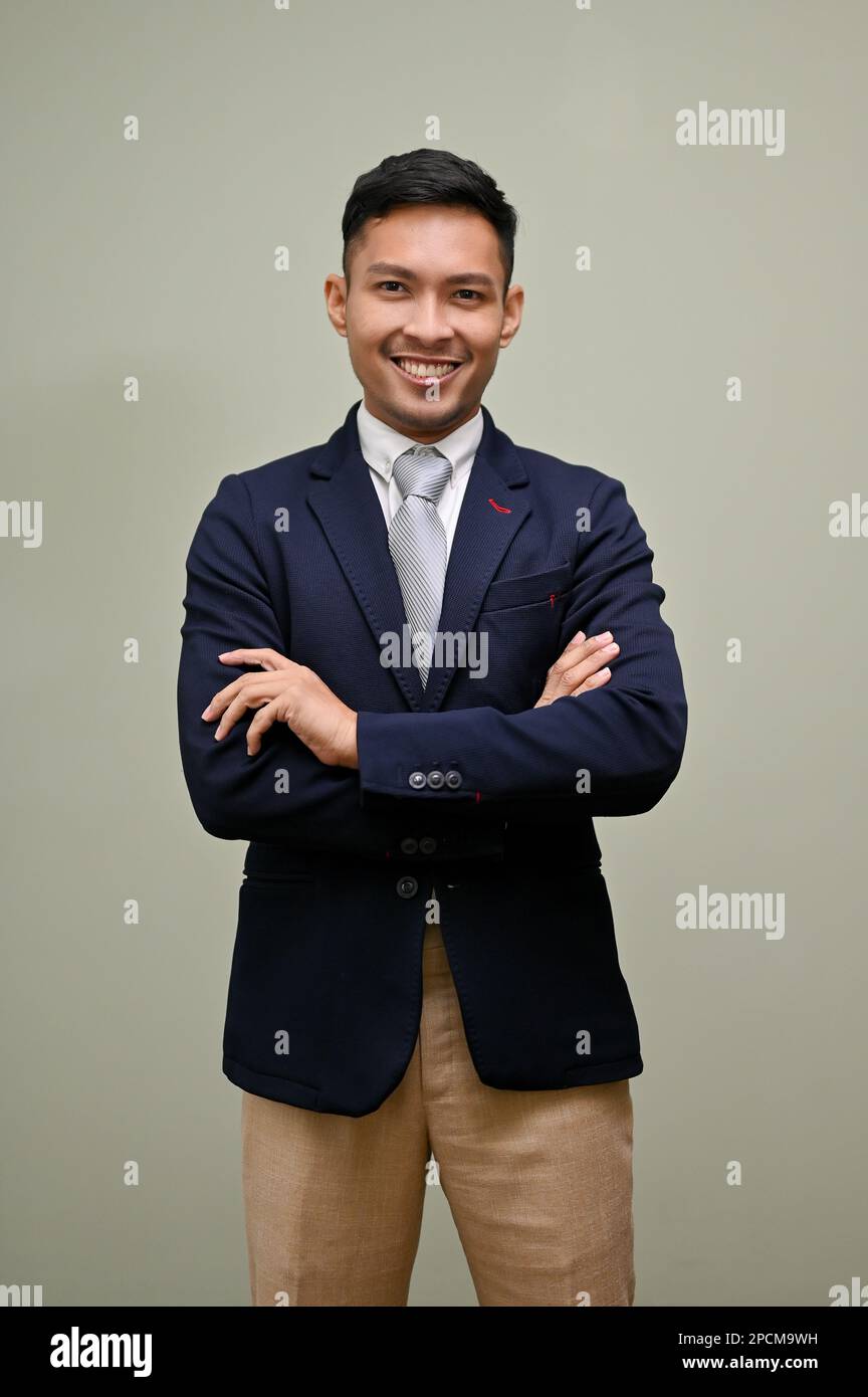 Portrait of handsome and successful millennial Asian businessman or ...