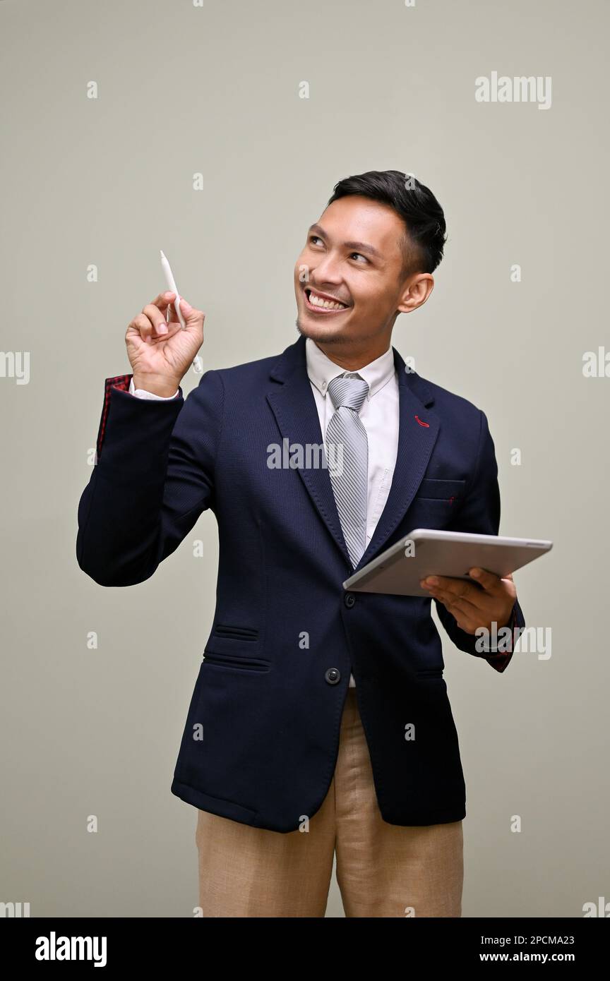 Smart and professional millennial Asian businessman or male CEO in ...