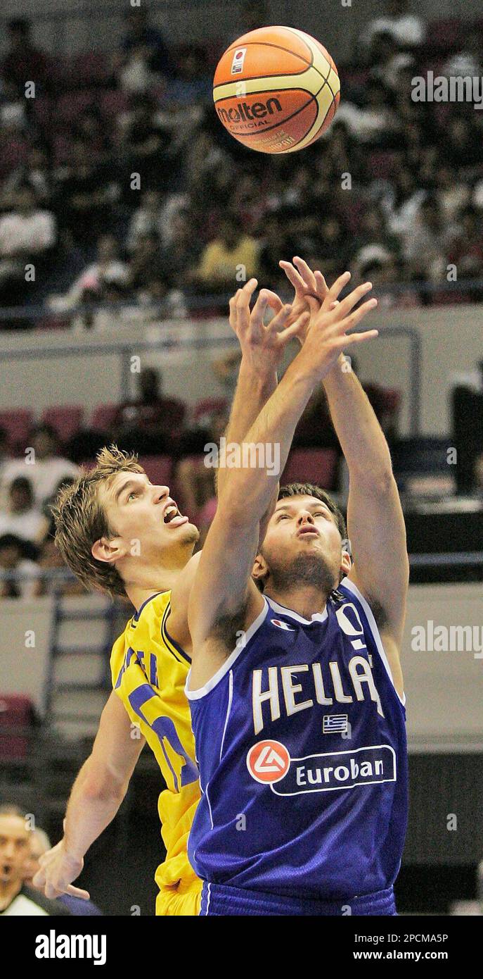 Greeces Antonios Fotsis, right, battles Brazils Tiago Splitter, left ...