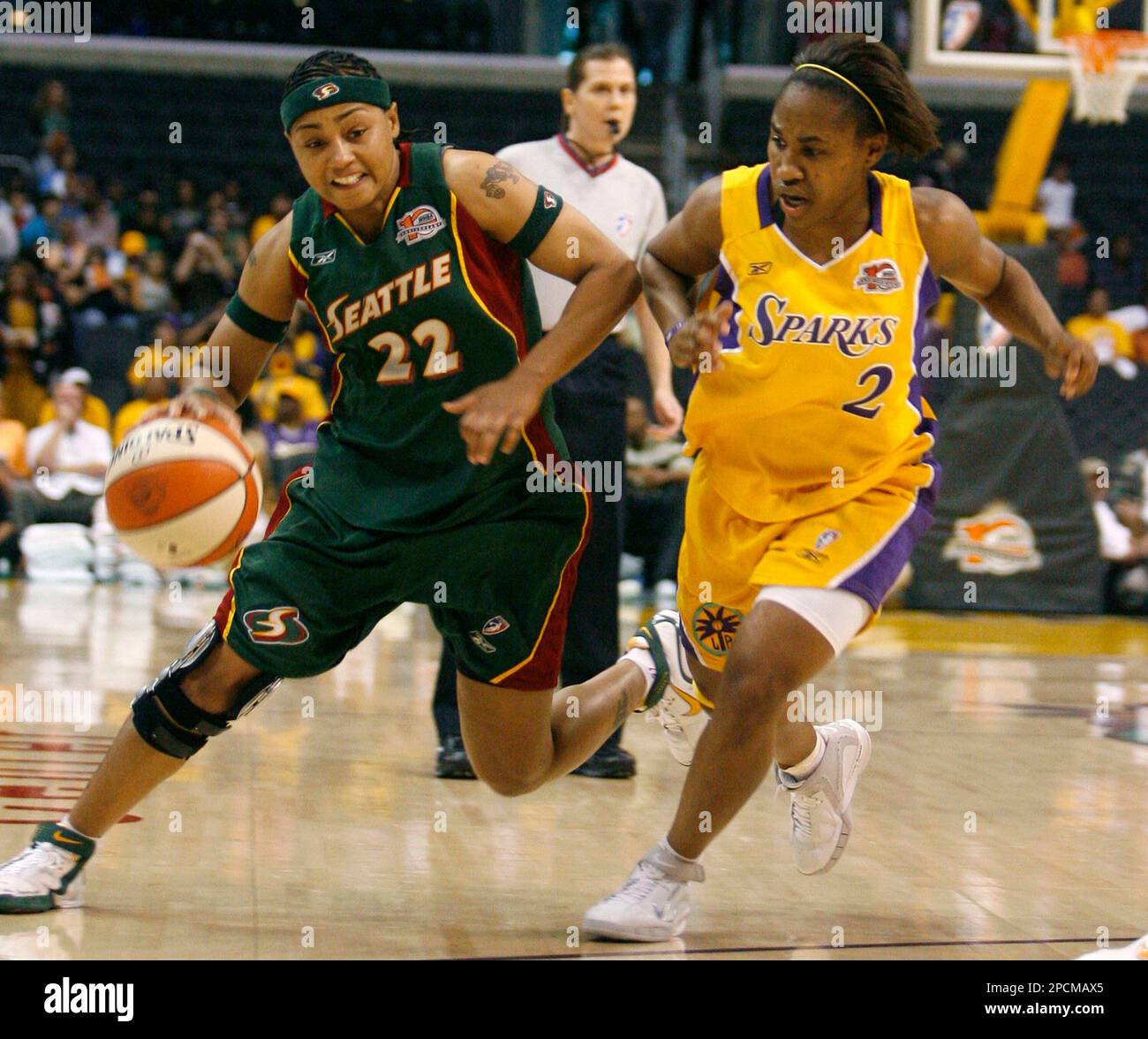 Seattle Storm's Betty Lennox, left, drives while being defended by Los ...