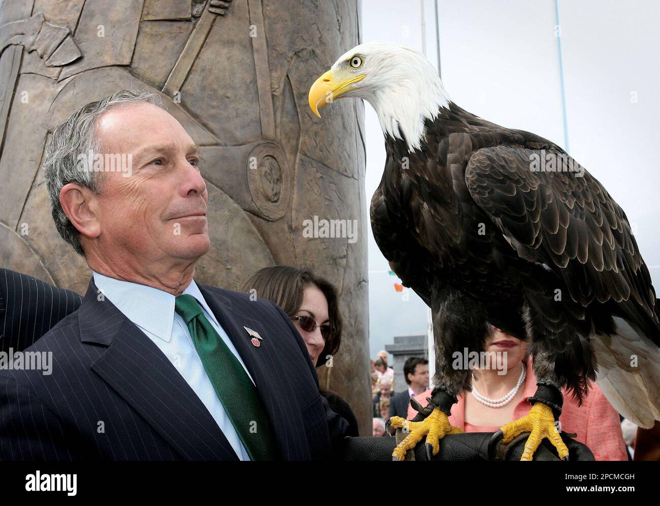 New York Mayor Michael Bloomberg holds aloft Alaska, an American Bald ...