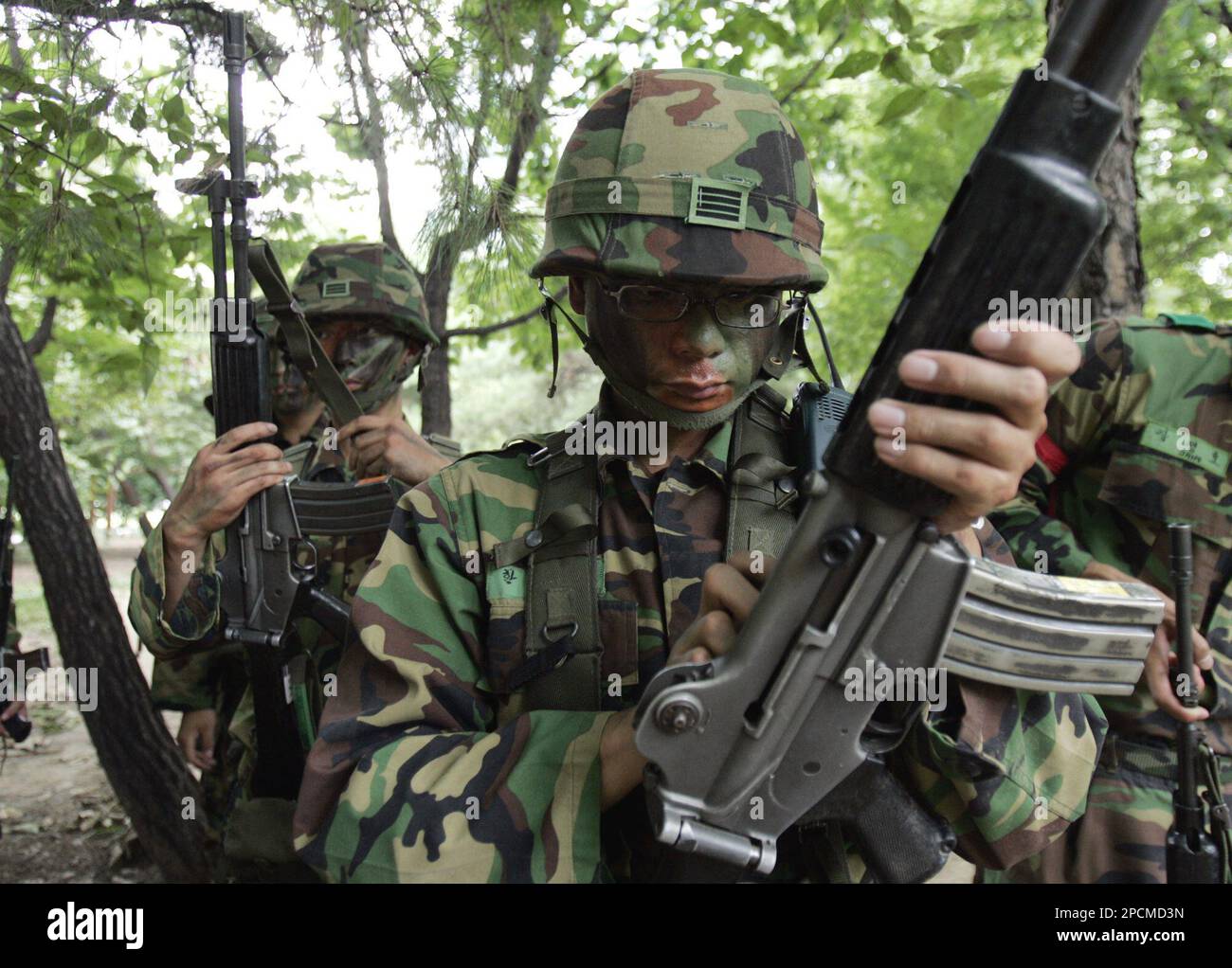 South Korean soldiers adjust their weapons during an annual joint ...