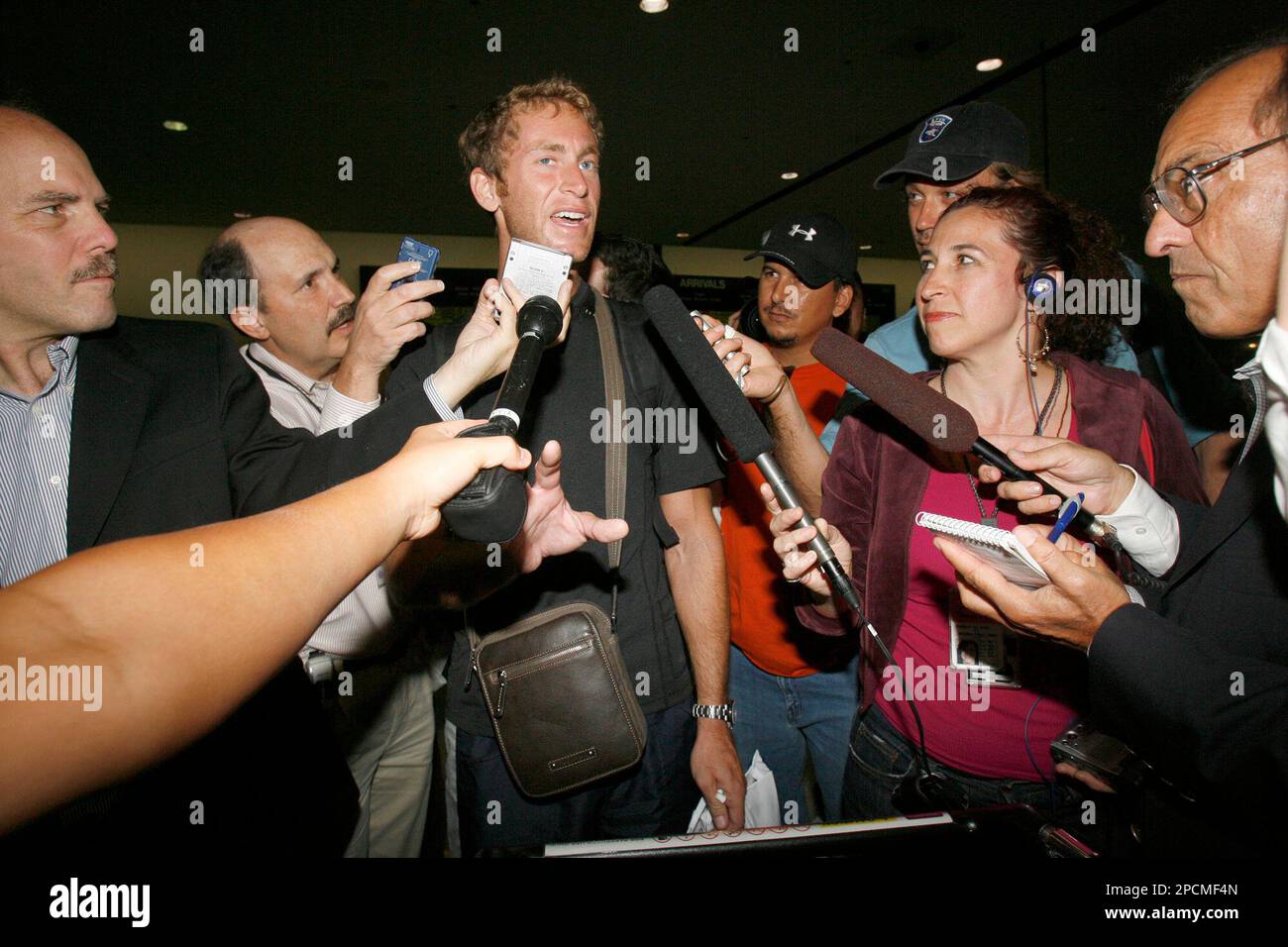 Dan Shiff of Montreal, Canada talks to reporters after arriving on the ...