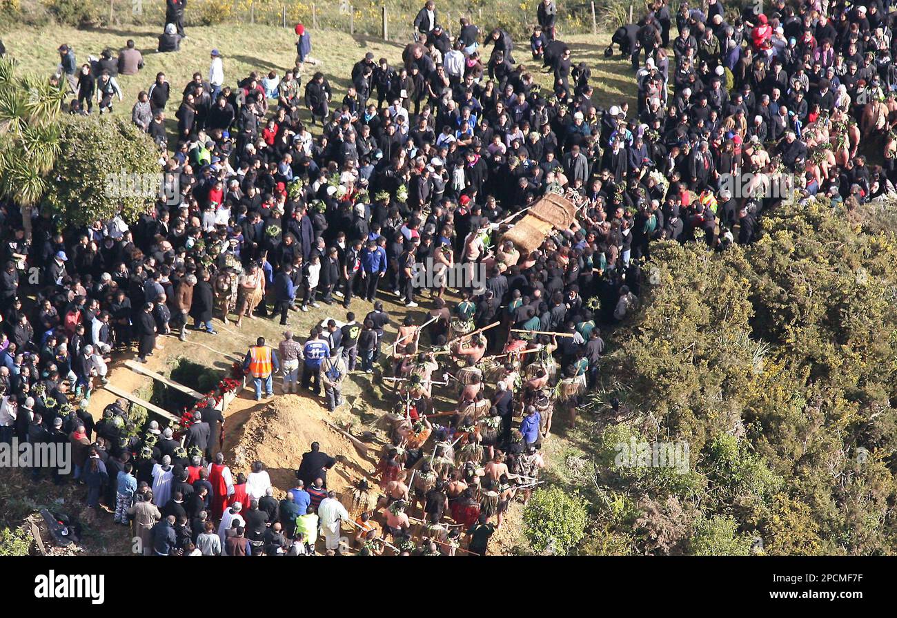 Maori warriors carry the coffin of Maori Queen Te Arikinui Dame Te ...