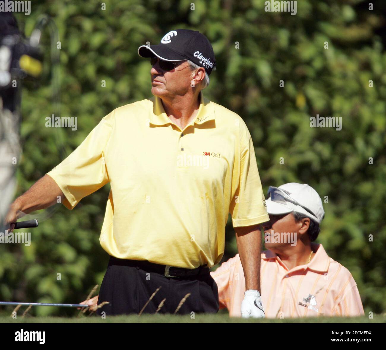 Don Pooley, left, and Massy Kuramoto look for Pooley's ball in the ...