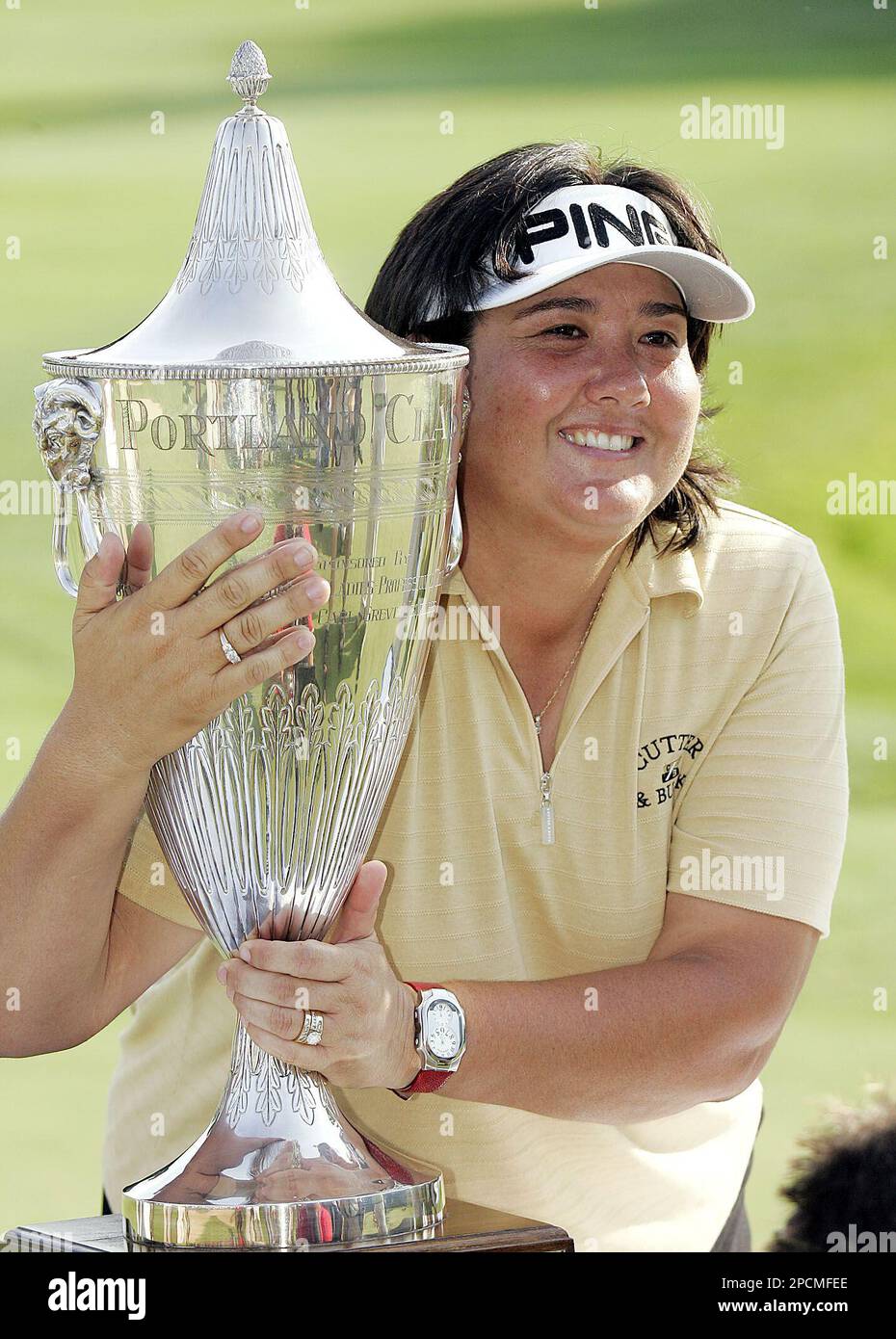 Pat Hurst, from Scottsdale, Ariz., holds the trophy after winning the ...