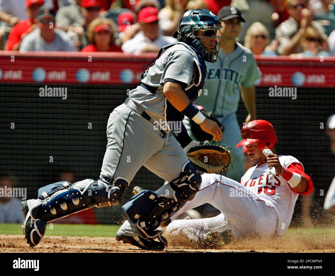 Seattle Mariners catcher Rene Rivera, left, waits for the throw as Los ...