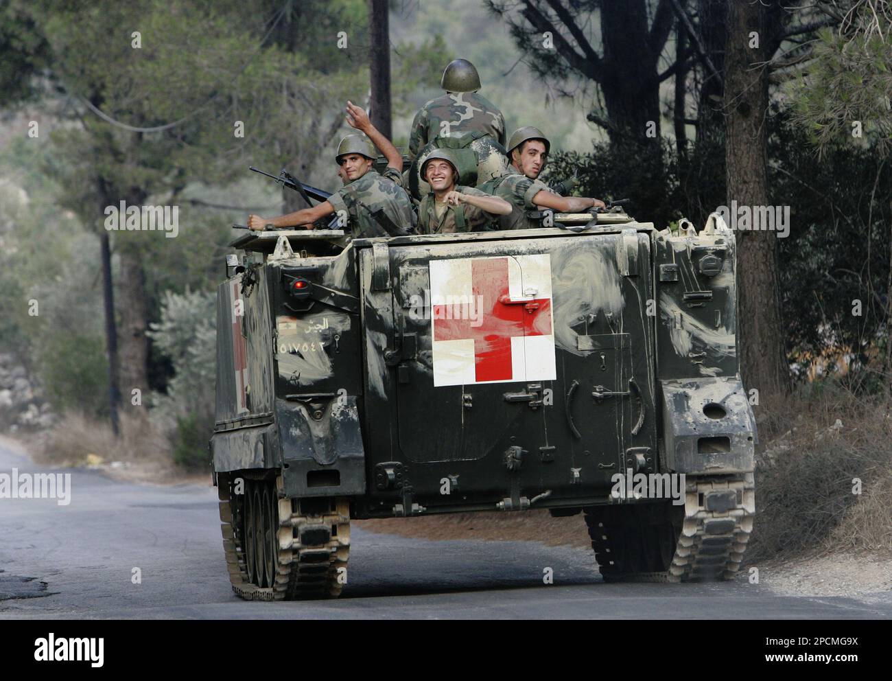 Lebanese soldiers atop an ambulance armored personnel carrier move to a ...