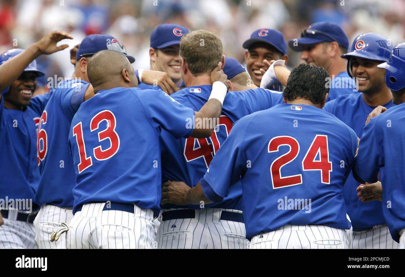 Chicago Cubs' Phil Nevin (40) is congratulated by teammates after ...
