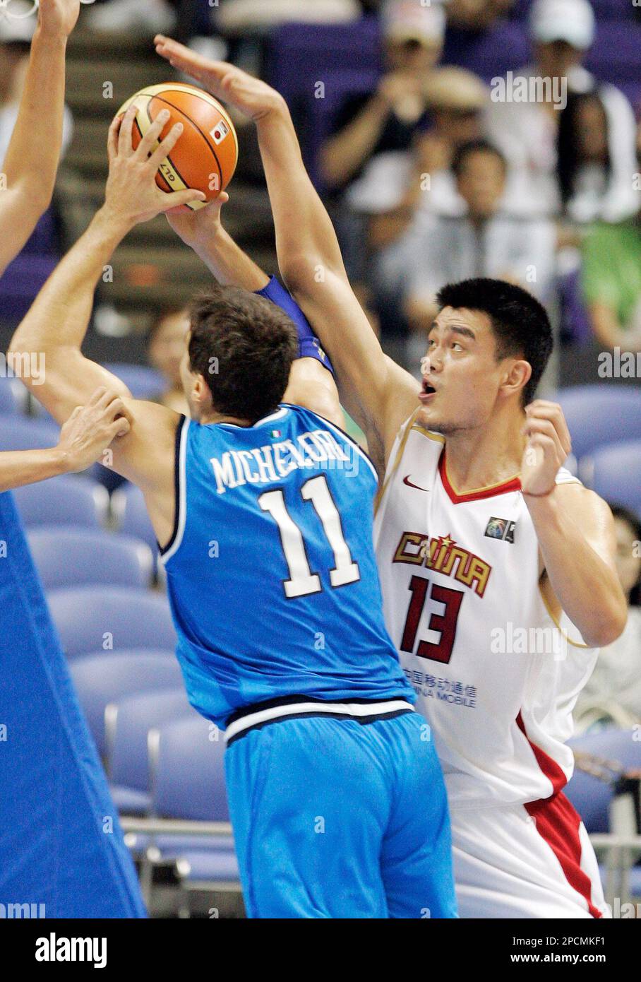China's Yao Ming (13) of the Houston Rockets tries to block the shot of ...