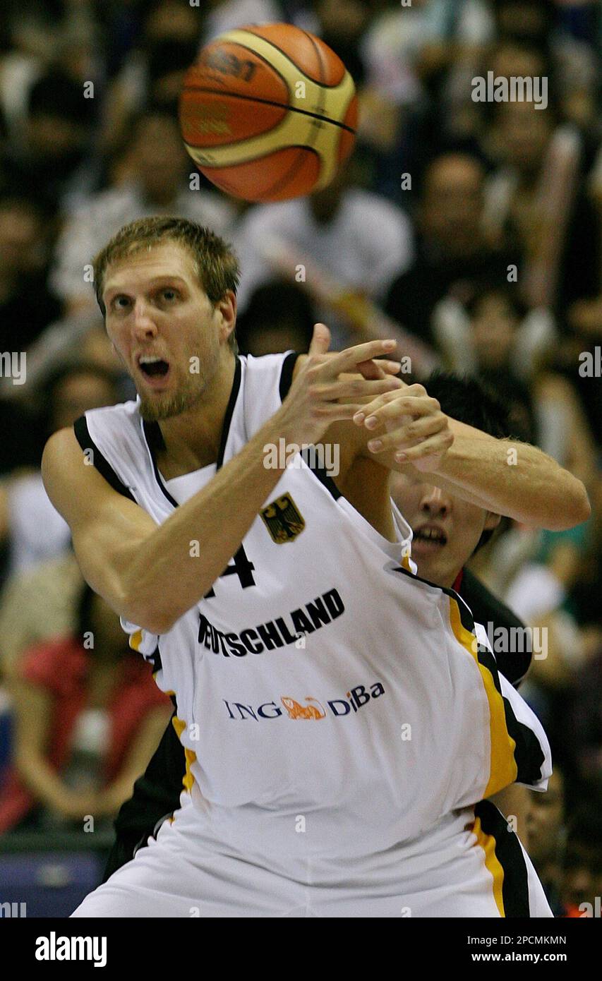 German NBA player Dirk Nowitzki, foreground, slips away the ball as ...