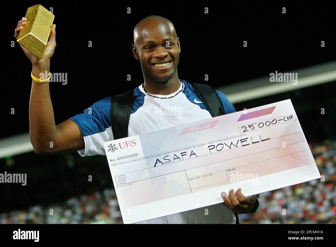 Jamaican Asafa Powell, winner of the men's 100 meter race, poses with a ...