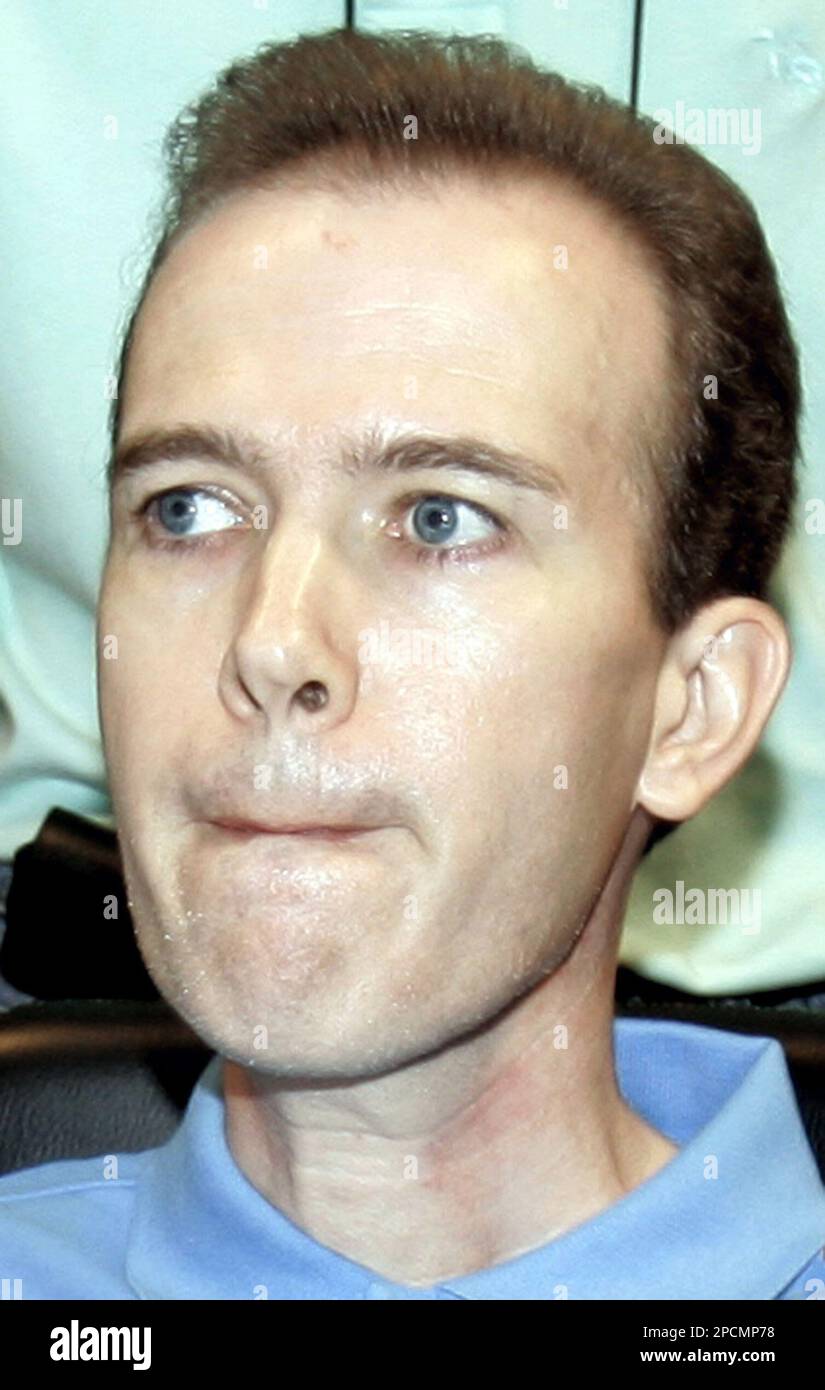 Murder suspect John Mark Karr bites his lips as he is shown at a police ...