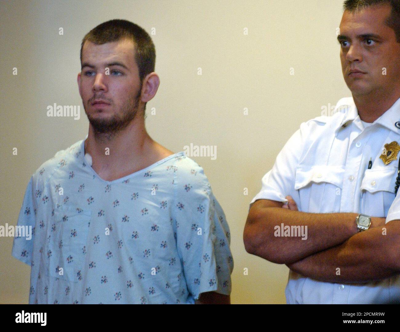 Joshua C. Whitaker, 20, of Hampden, Mass., left, stands during his ...