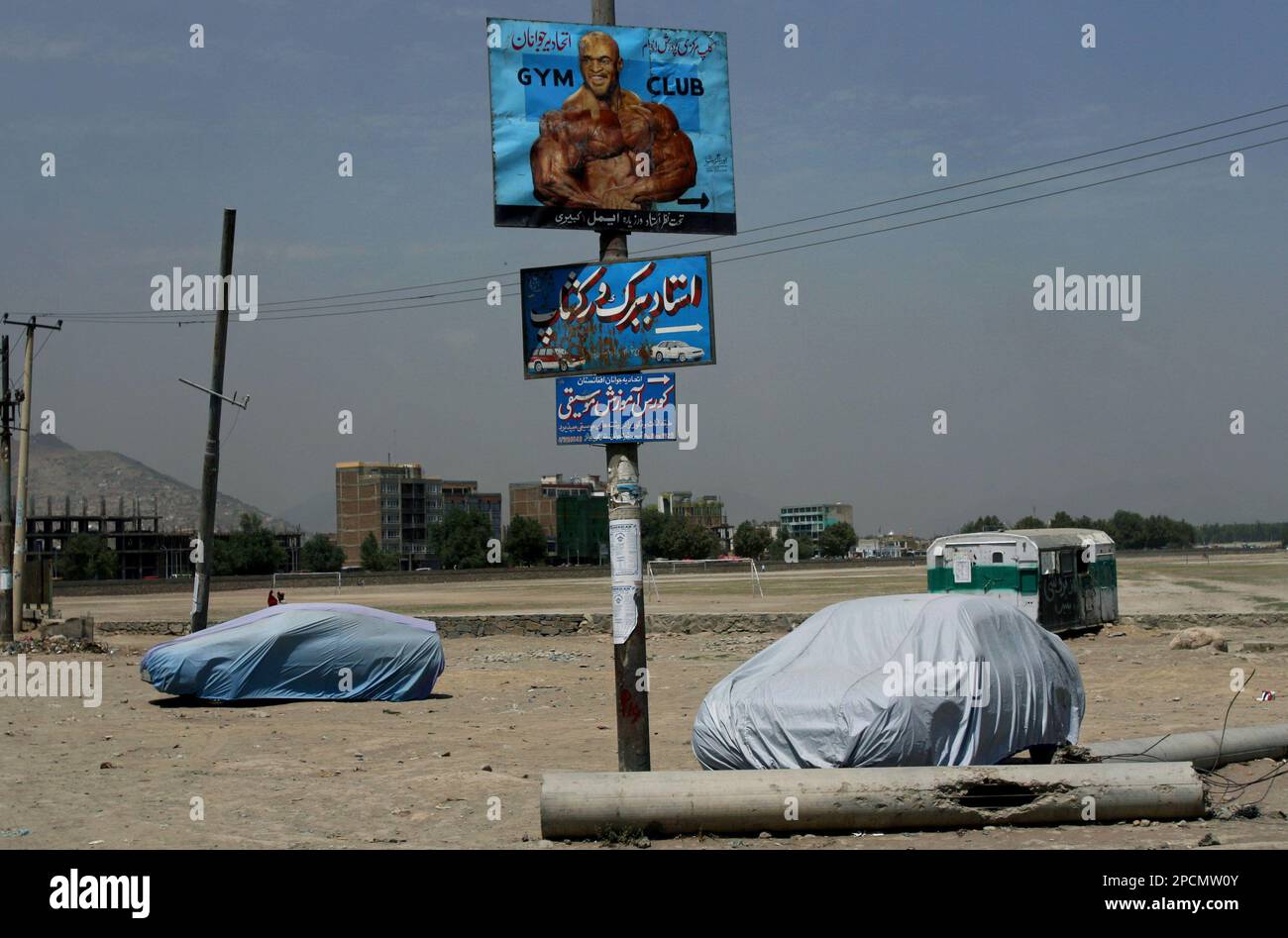 A poster that indicates the place of a new gym is seen downtown Kabul ...