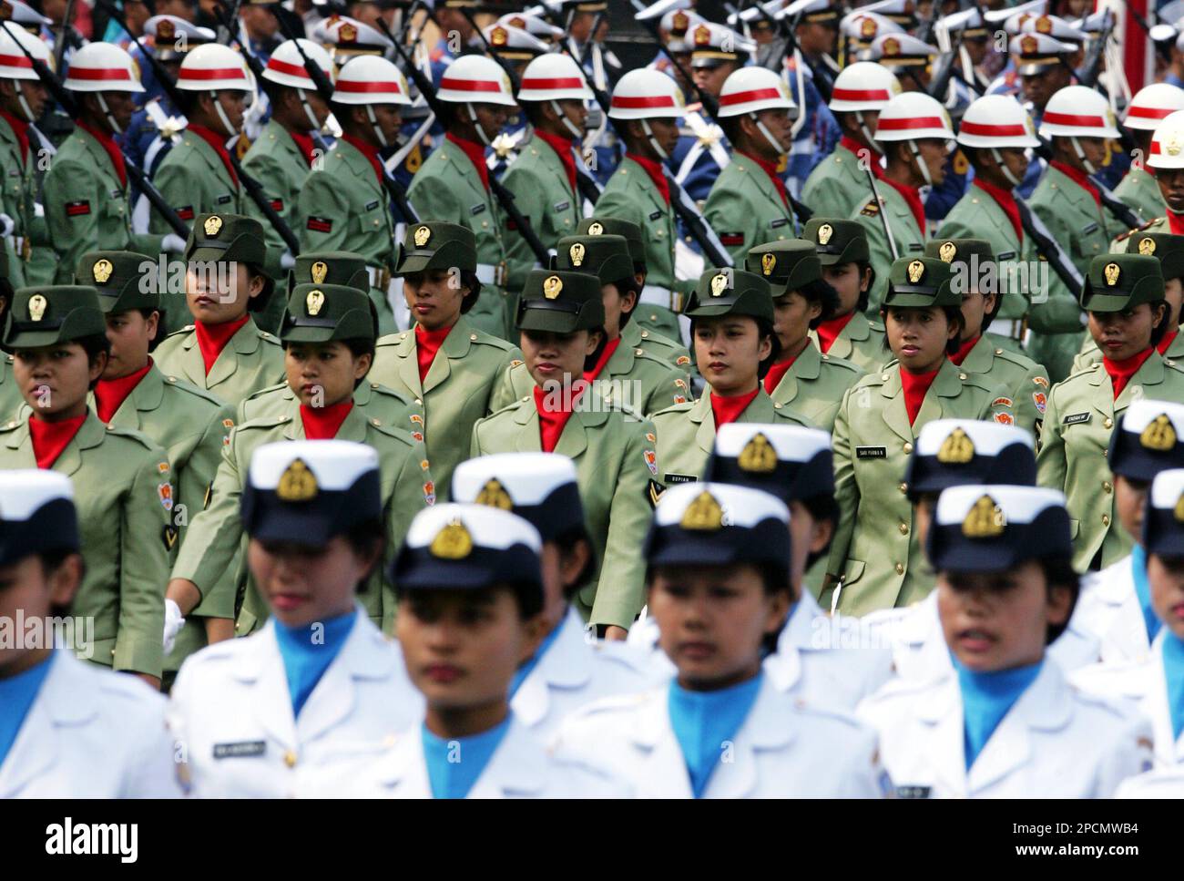 Indonesian soldiers march during the celebration of the 61st ...