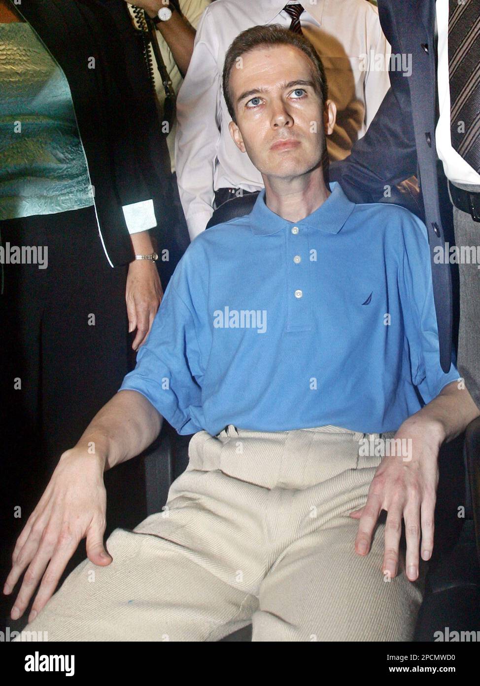 American John Mark Karr, sitting center, is shown at a police news ...