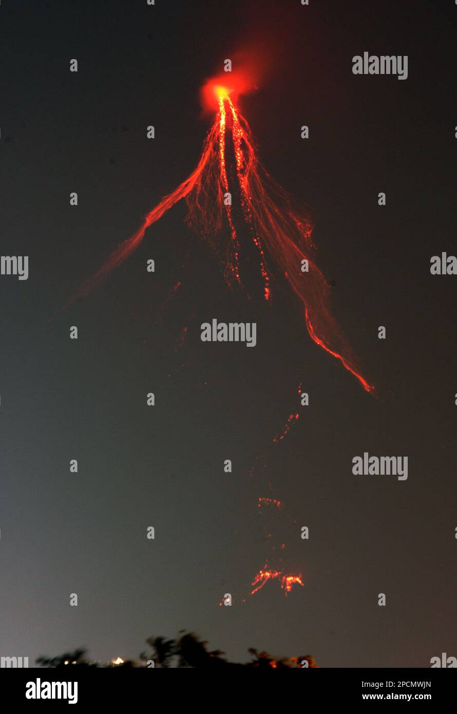 A significant volume of lava flows down the slopes of Mayon volcano as ...