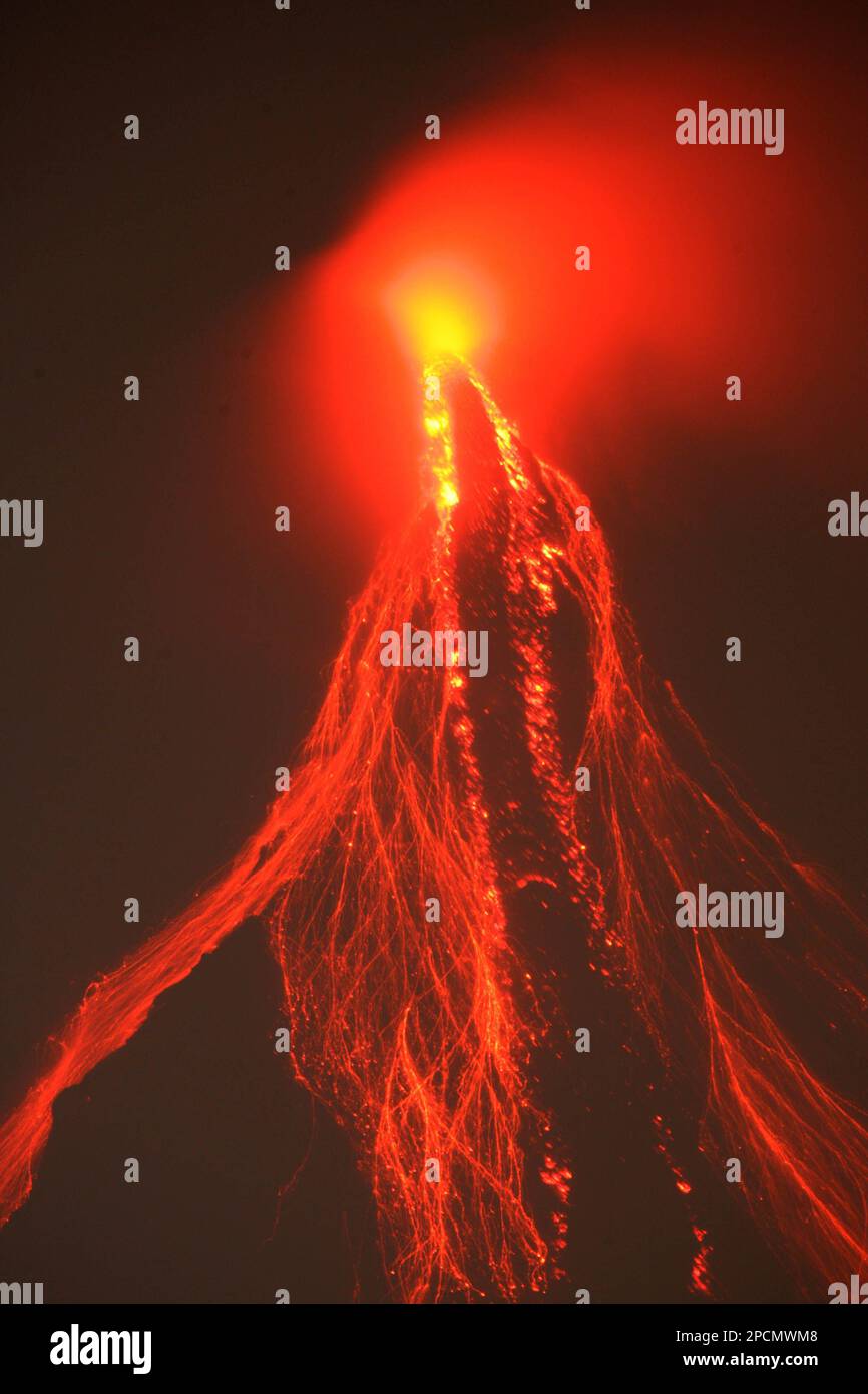 A significant volume of lava flows down the slopes of Mayon volcano as ...