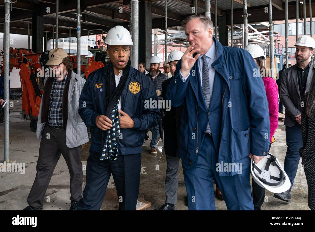 Mayor Eric Adams tours of the former office building being converted to ...