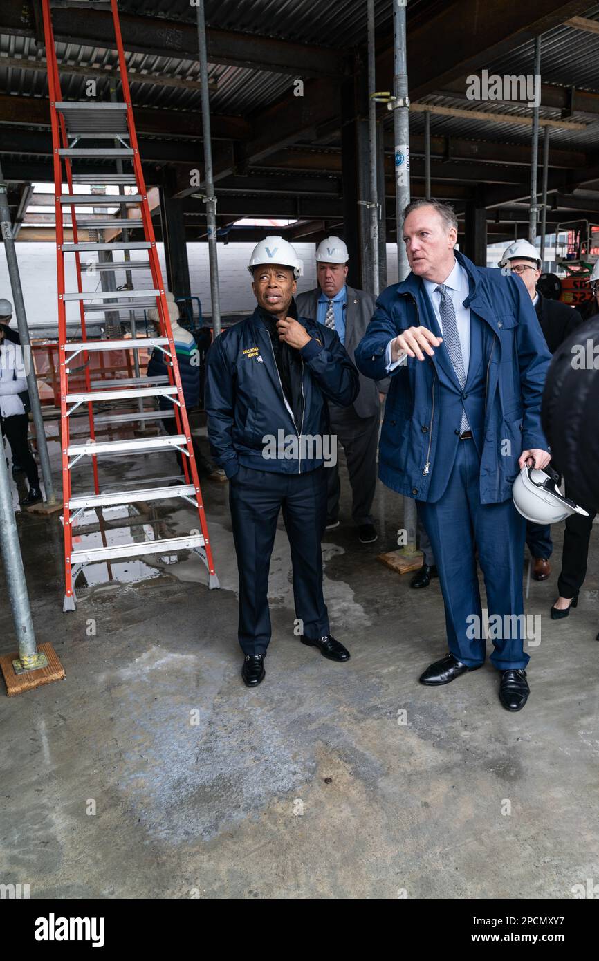 Mayor Eric Adams tours of the former office building being converted to ...