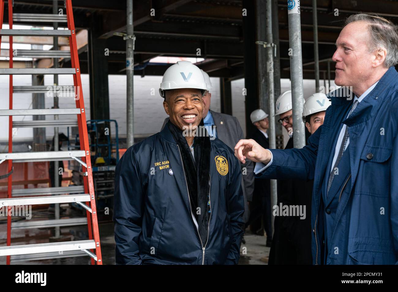 Mayor Eric Adams tours of the former office building being converted to ...