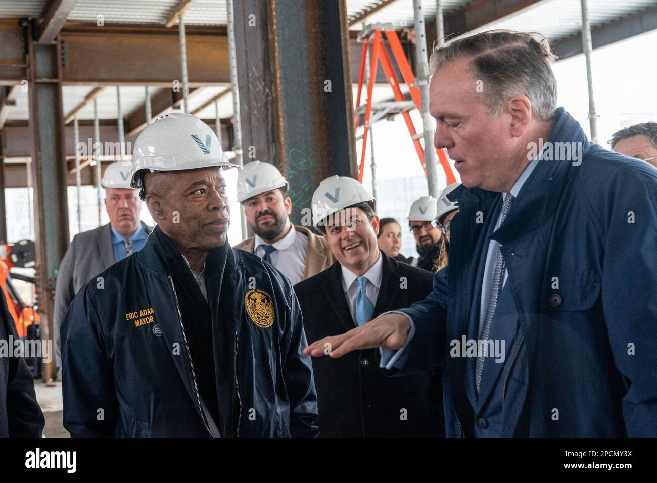 Mayor Eric Adams tours of the former office building being converted to ...