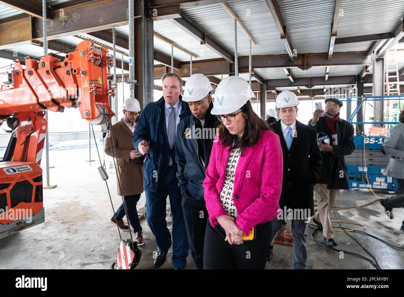 Mayor Eric Adams tours of the former office building being converted to ...
