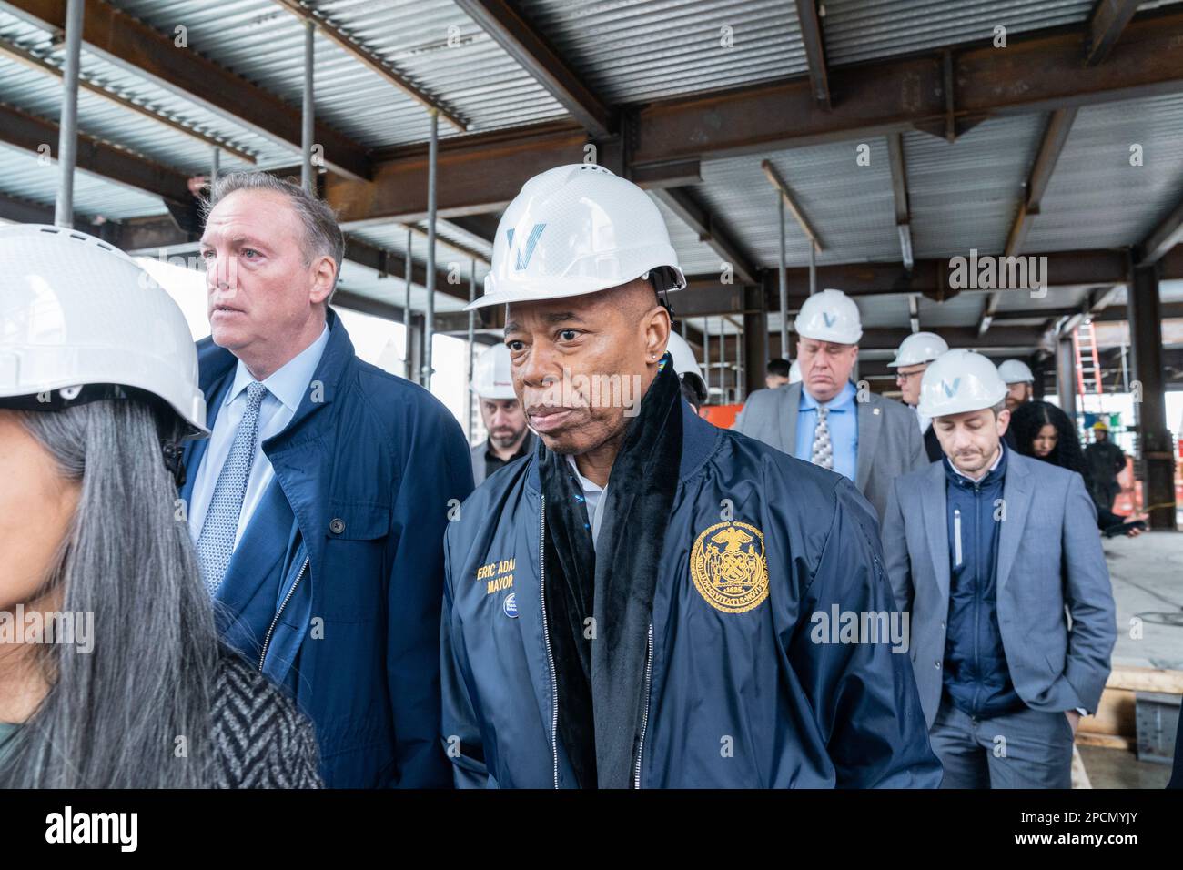Mayor Eric Adams tours of the former office building being converted to ...