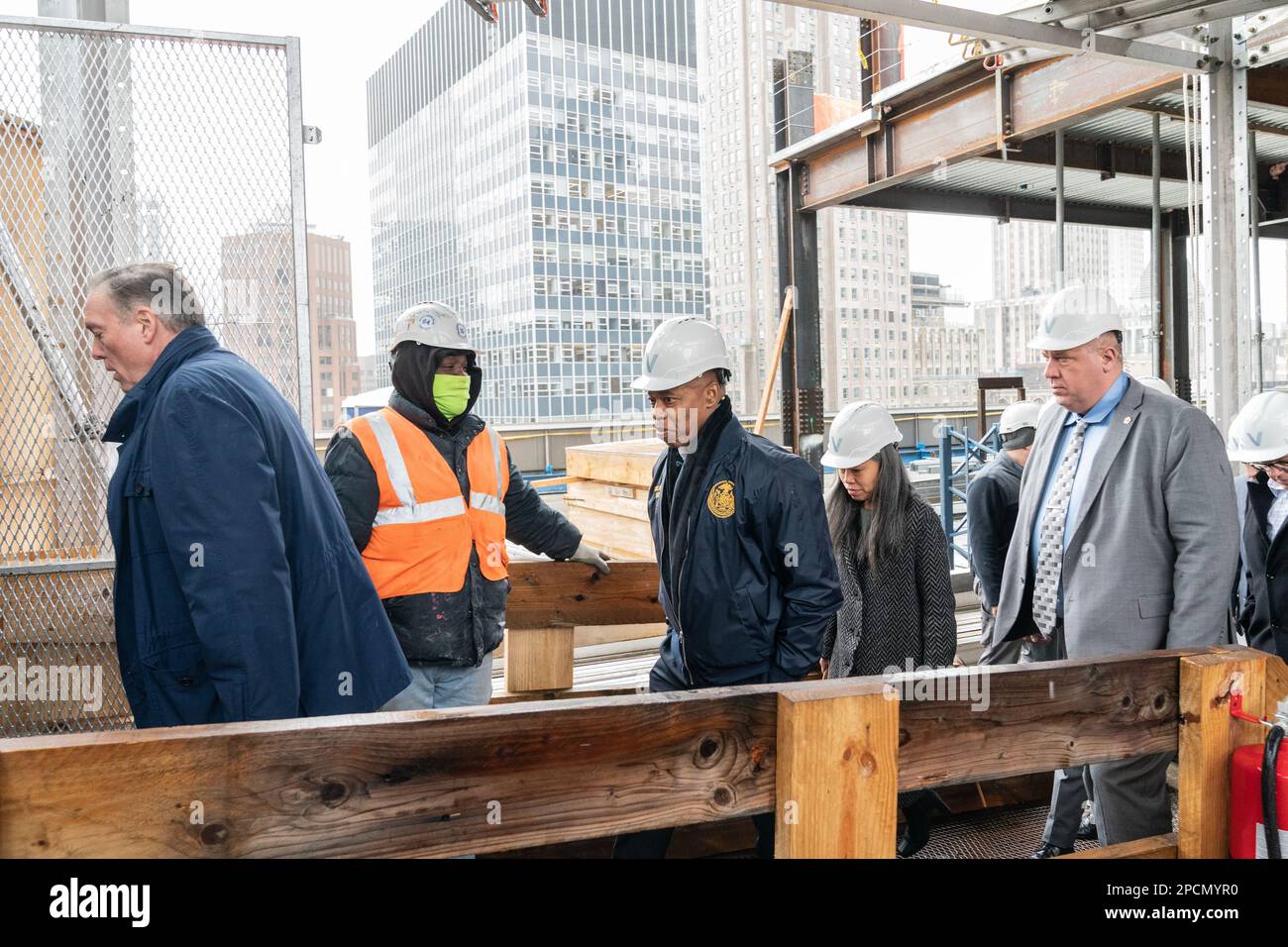 Mayor Eric Adams tours of the former office building being converted to ...
